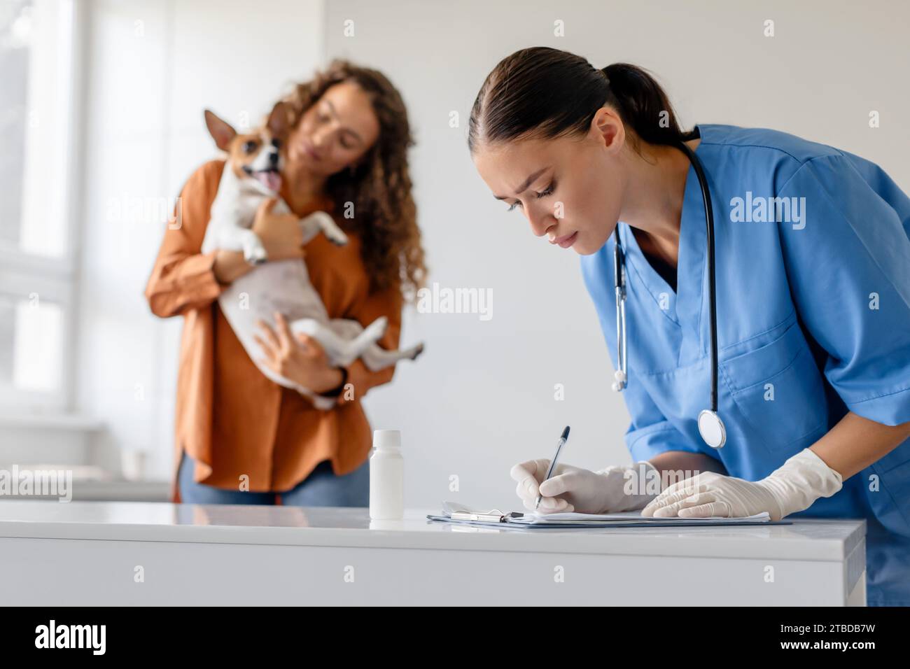 Female medical professional takes notes hi-res stock photography and ...
