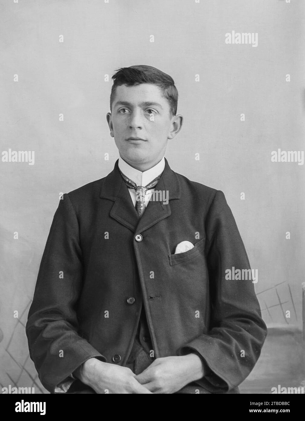 Edwardian formal portrait of a young man in a suit, sitting. Taken from ...