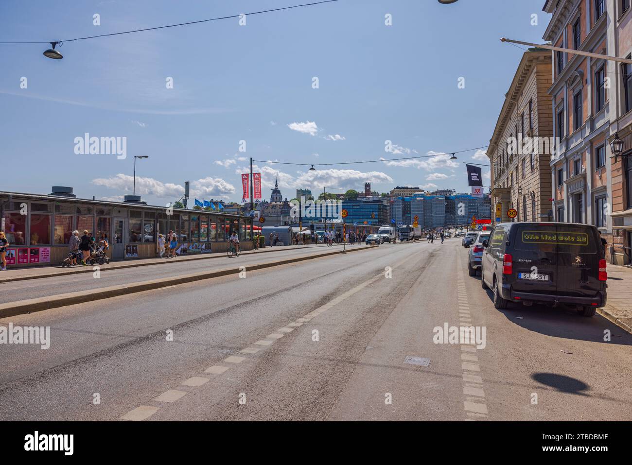 People leisurely stroll along bustling streets of central Stockholm ...