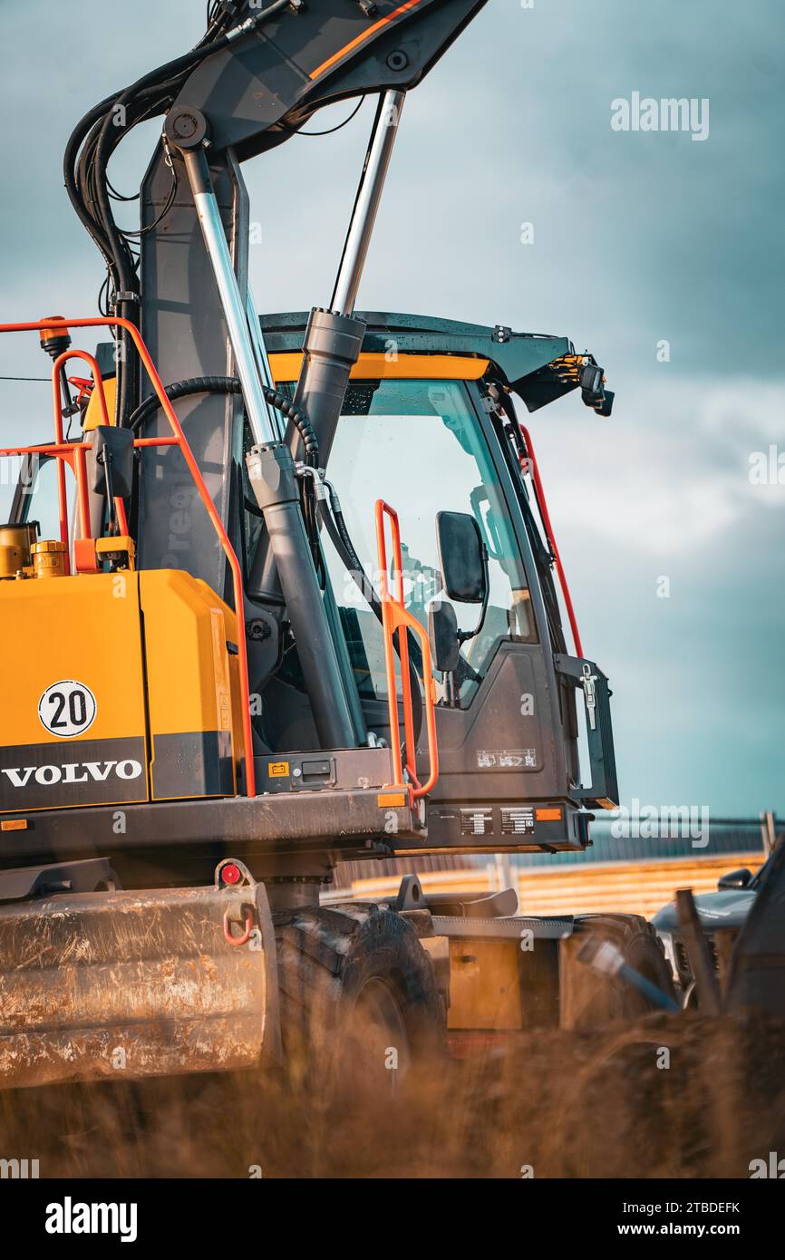 Yellow Volvo tracked excavator on construction site Stock Photo - Alamy