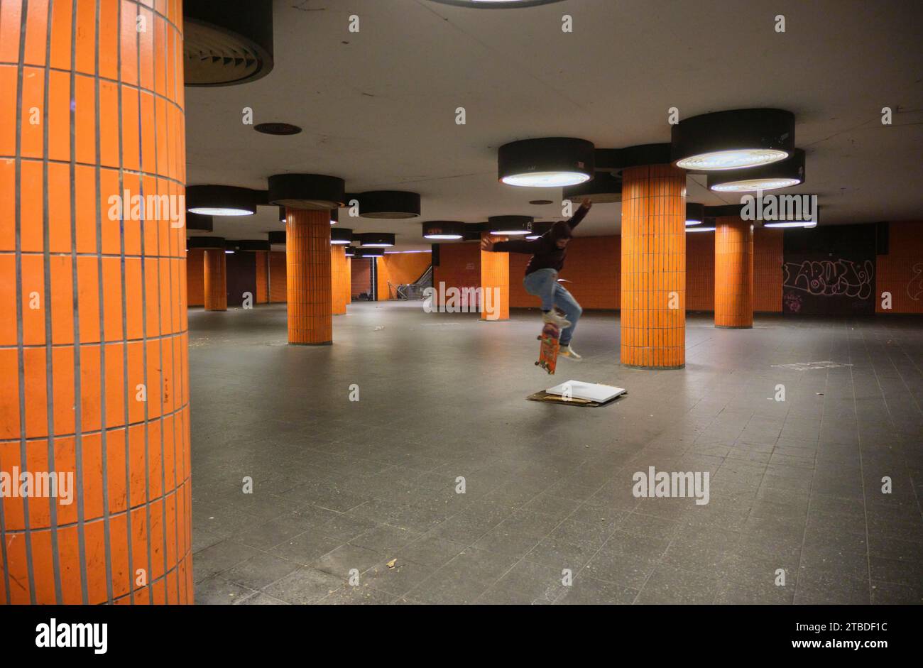 Germany, Berlin, 15.11.2023, Messedamm subway, orange columns, skaters ...