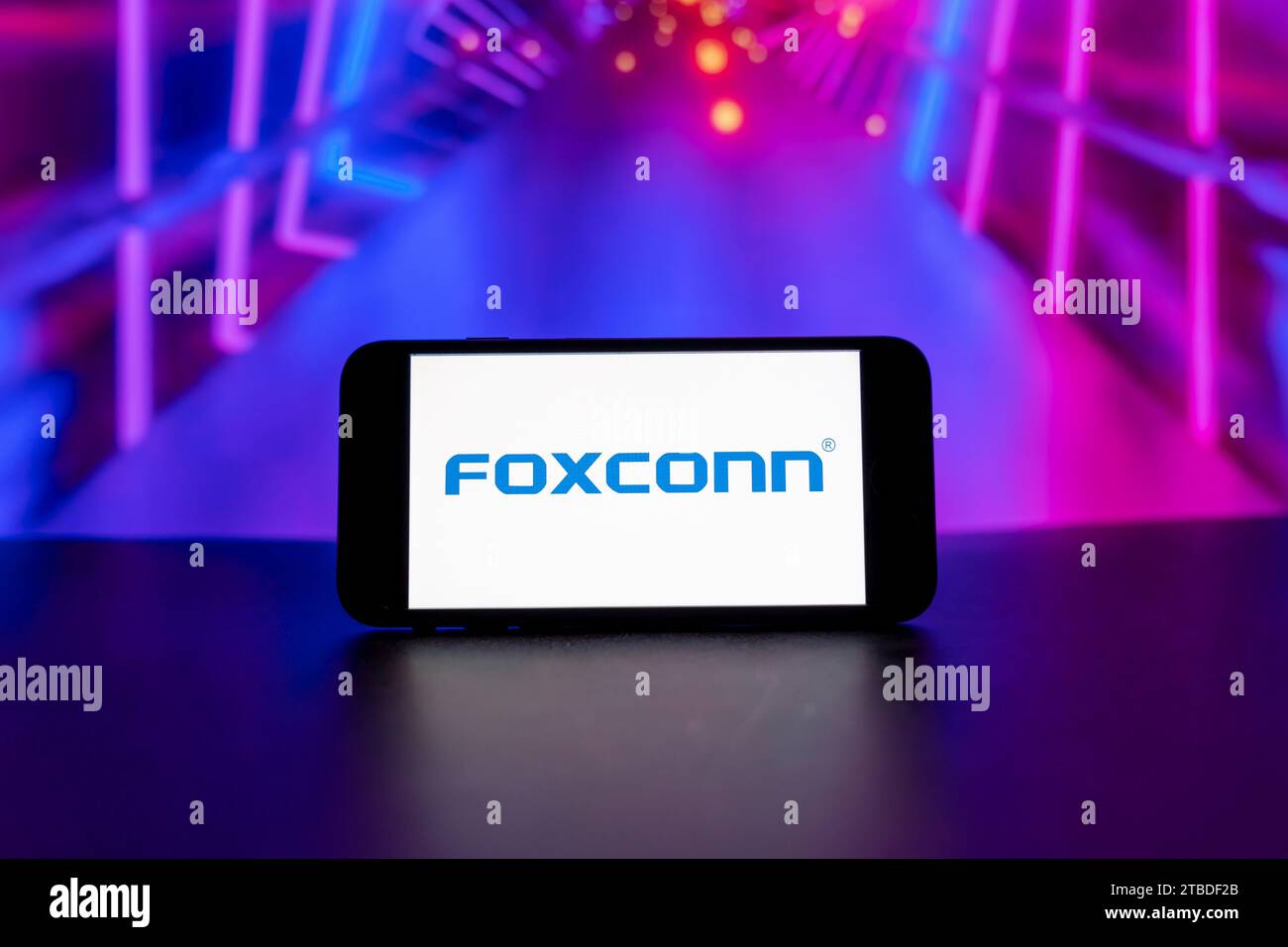 In this photo illustration, a Foxconn logo is seen displayed on a ...