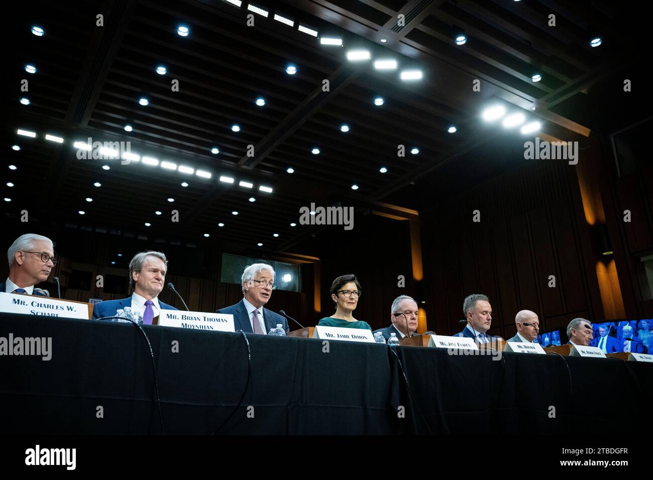 JPMorgan Chase & Co. Chairman and CEO Jamie Dimon (third-left ...