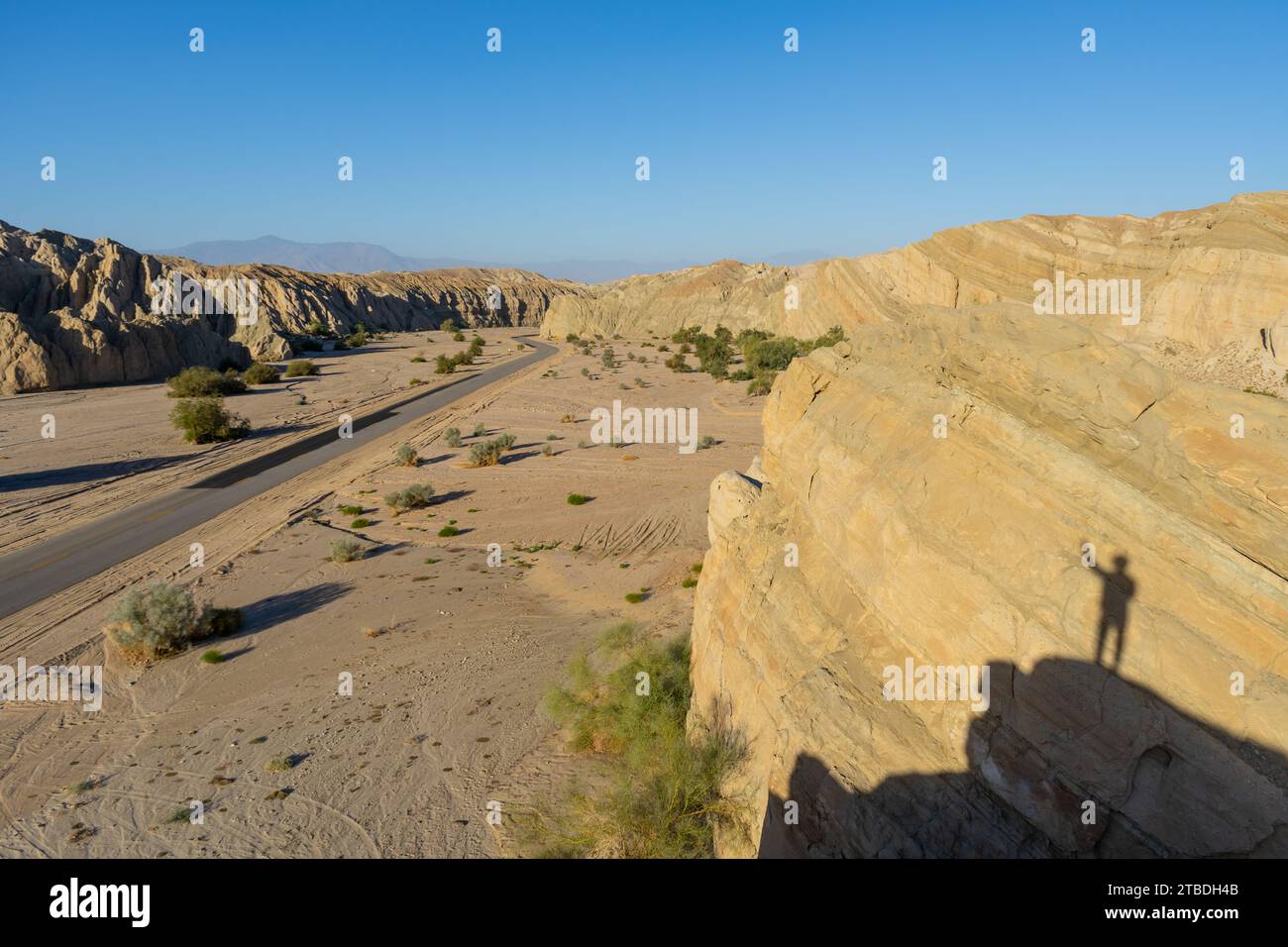 Silhouette of a person cast on a rock face in Box Canyon Wash in Mojave ...