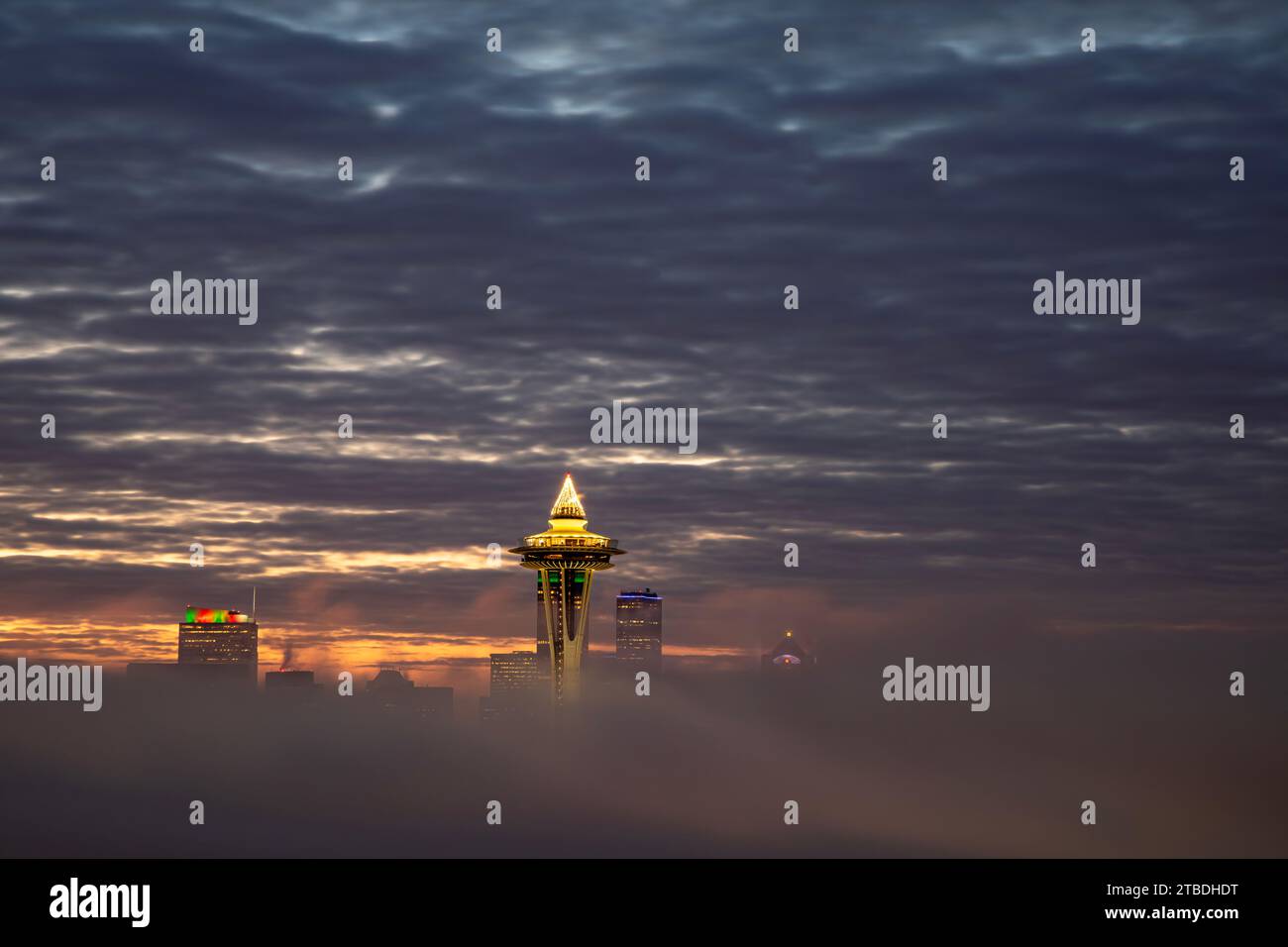 WA23858-00...WASHINGTON - Dawn on a foggy Seattle morning with only the ...