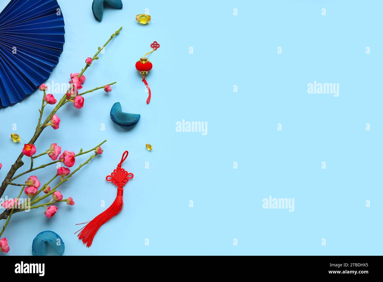 Composition with blooming sakura branch and chinese symbols on color ...