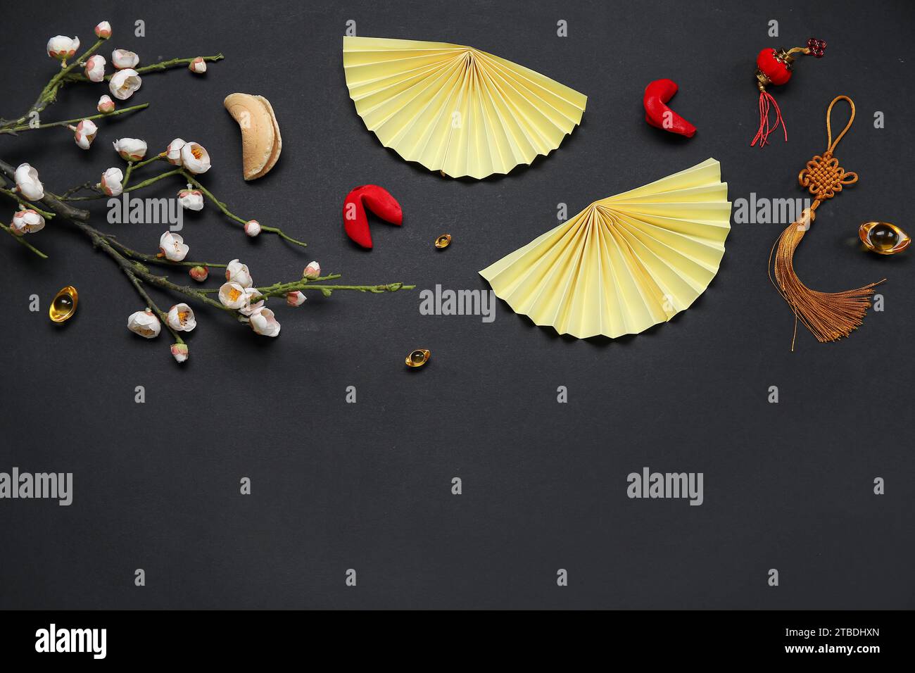 Composition with Chinese symbols, sakura branch and fortune cookies on ...