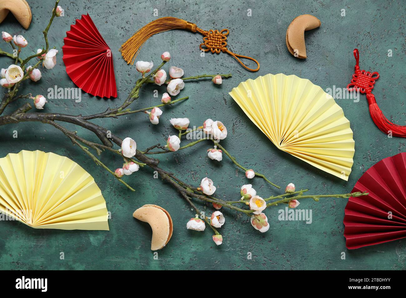 Composition with Chinese symbols and blooming sakura branch on color ...