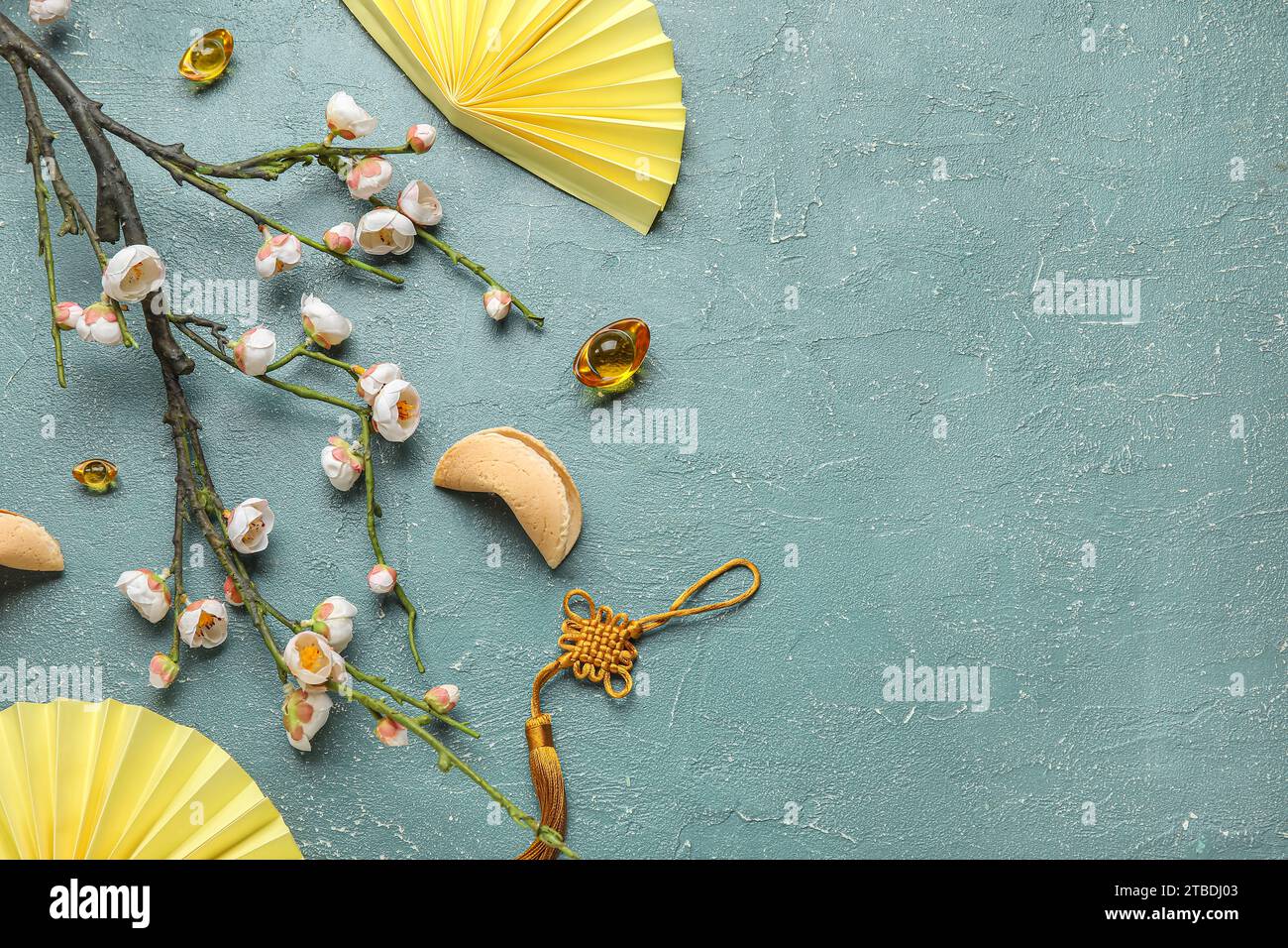 Composition with blooming sakura branch and Chinese symbols on color ...