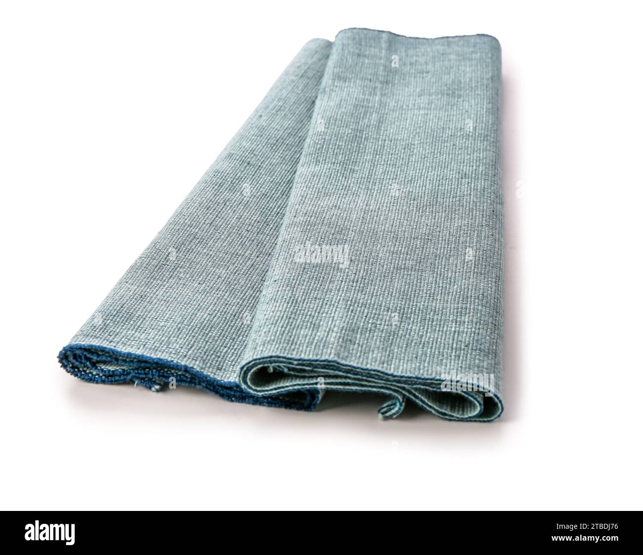 Folded table mats on white background Stock Photo - Alamy