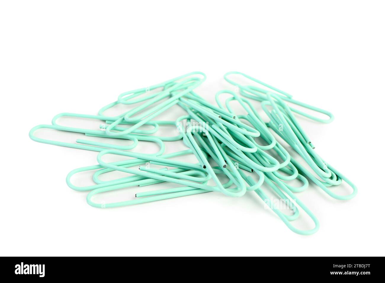 Heap of green paper clips on white background Stock Photo - Alamy