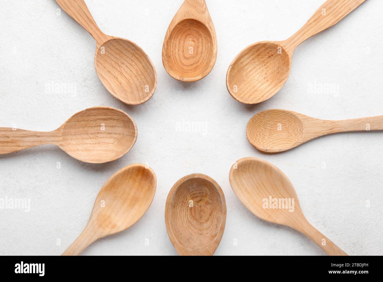 Frame made of different wooden spoons on light background Stock Photo ...