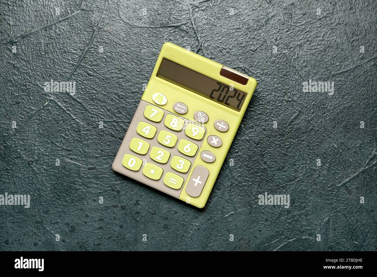 Calculator with number 2024 on dark background Stock Photo - Alamy