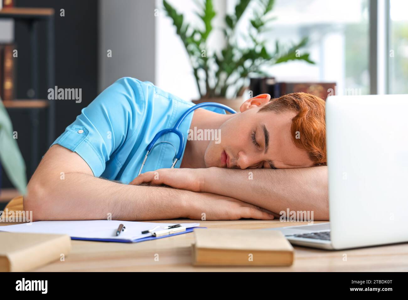 Tired male medical intern hi-res stock photography and images - Alamy