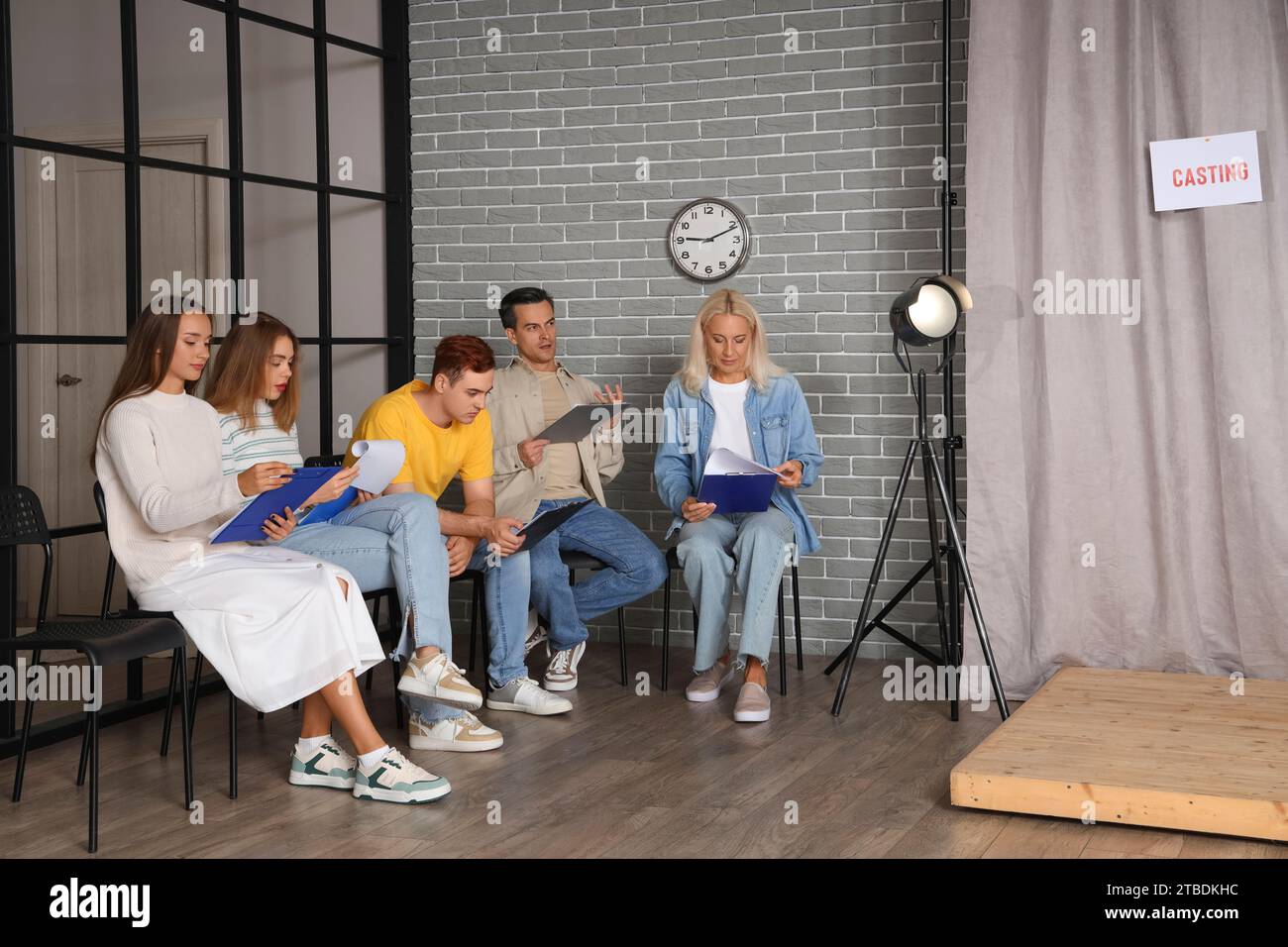 Actors waiting for their turn in audition room Stock Photo - Alamy