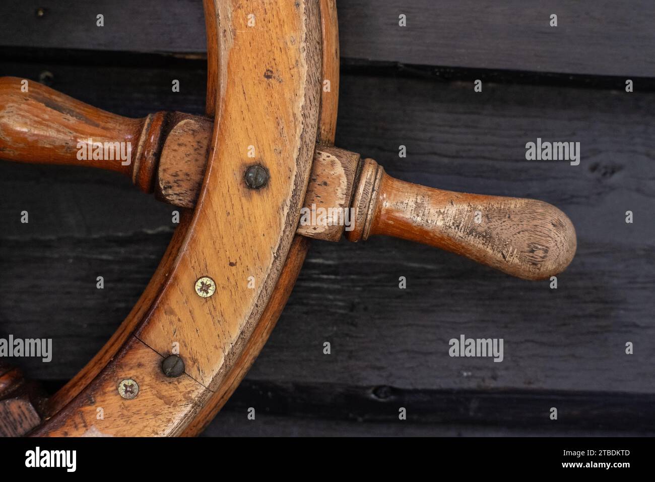 Details of a wooden ship steering wheel Stock Photo - Alamy