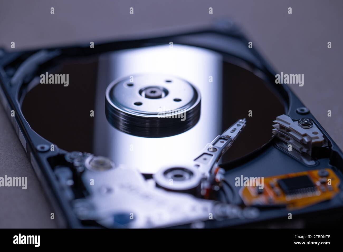Mechanics inside a hard disk drive with platter and read write head ...
