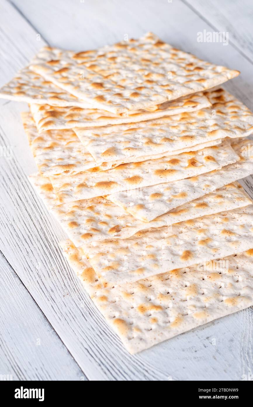 Stack of Matzah on the white wooden background Stock Photo - Alamy