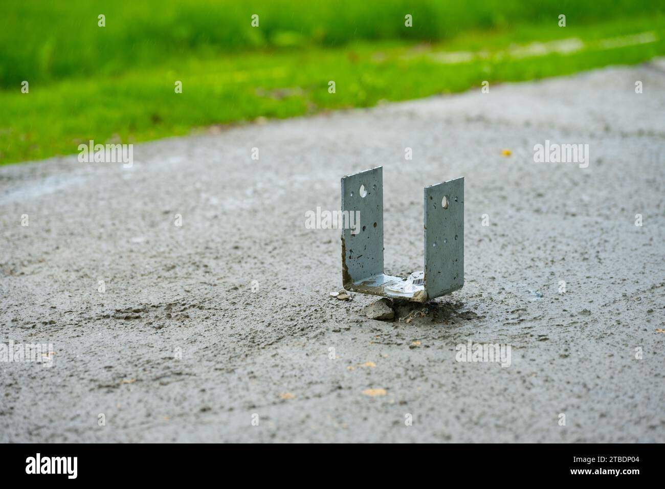 Metal beam fixing set in concrete Stock Photo - Alamy