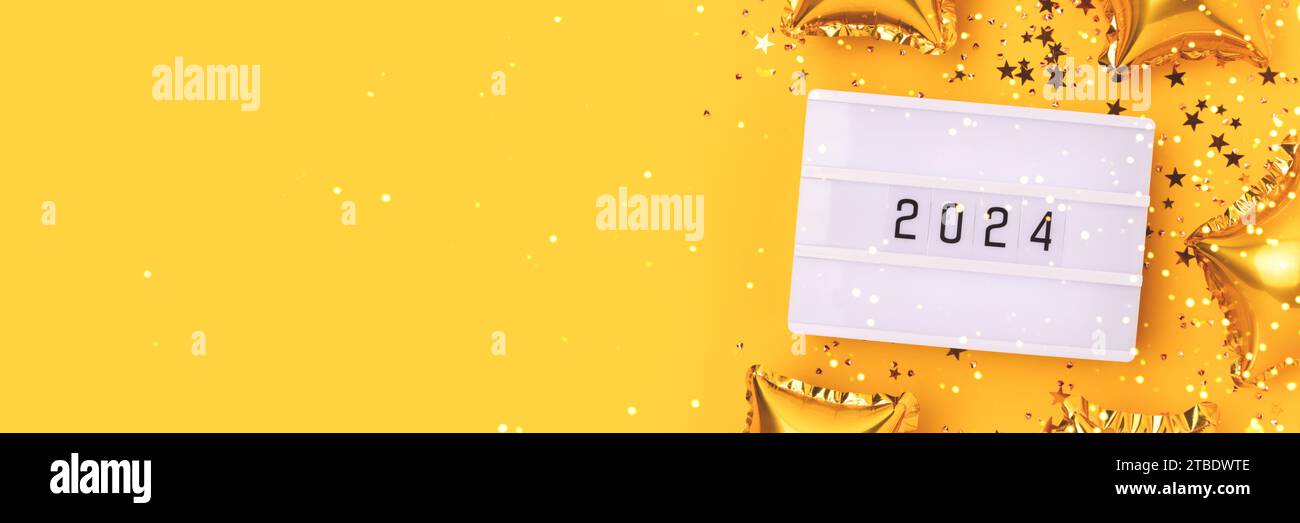 Banner with 2024 numbers on a yellow background. Golden stars confetti ...