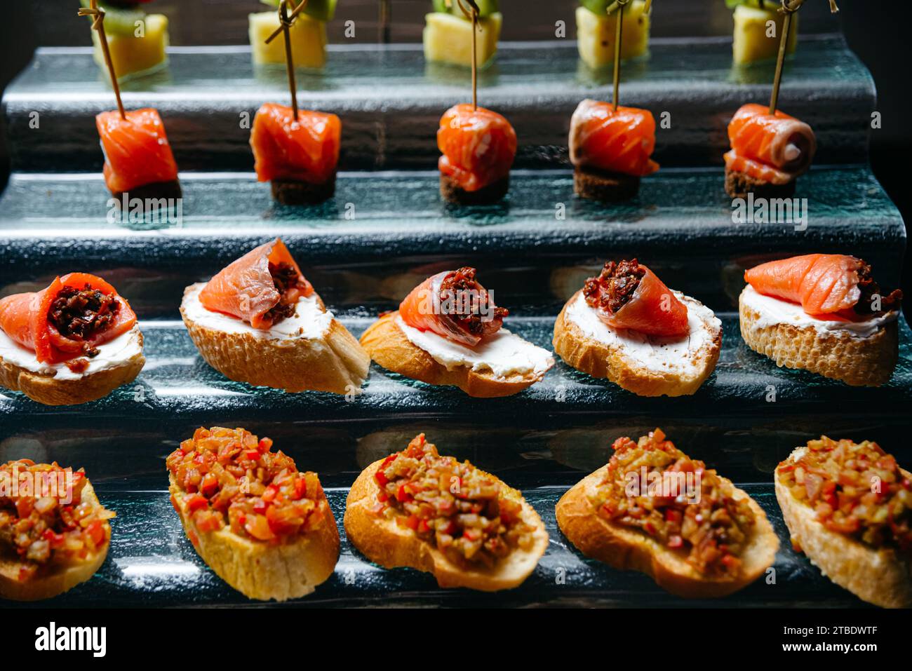 A display case filled with different types of appetizers Stock Photo ...
