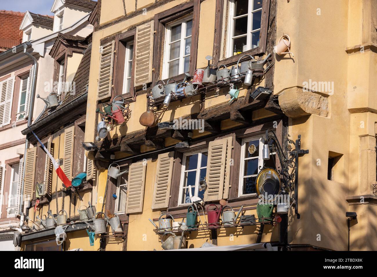 old half-timbered house with watering cans in Colmar, France in summer ...