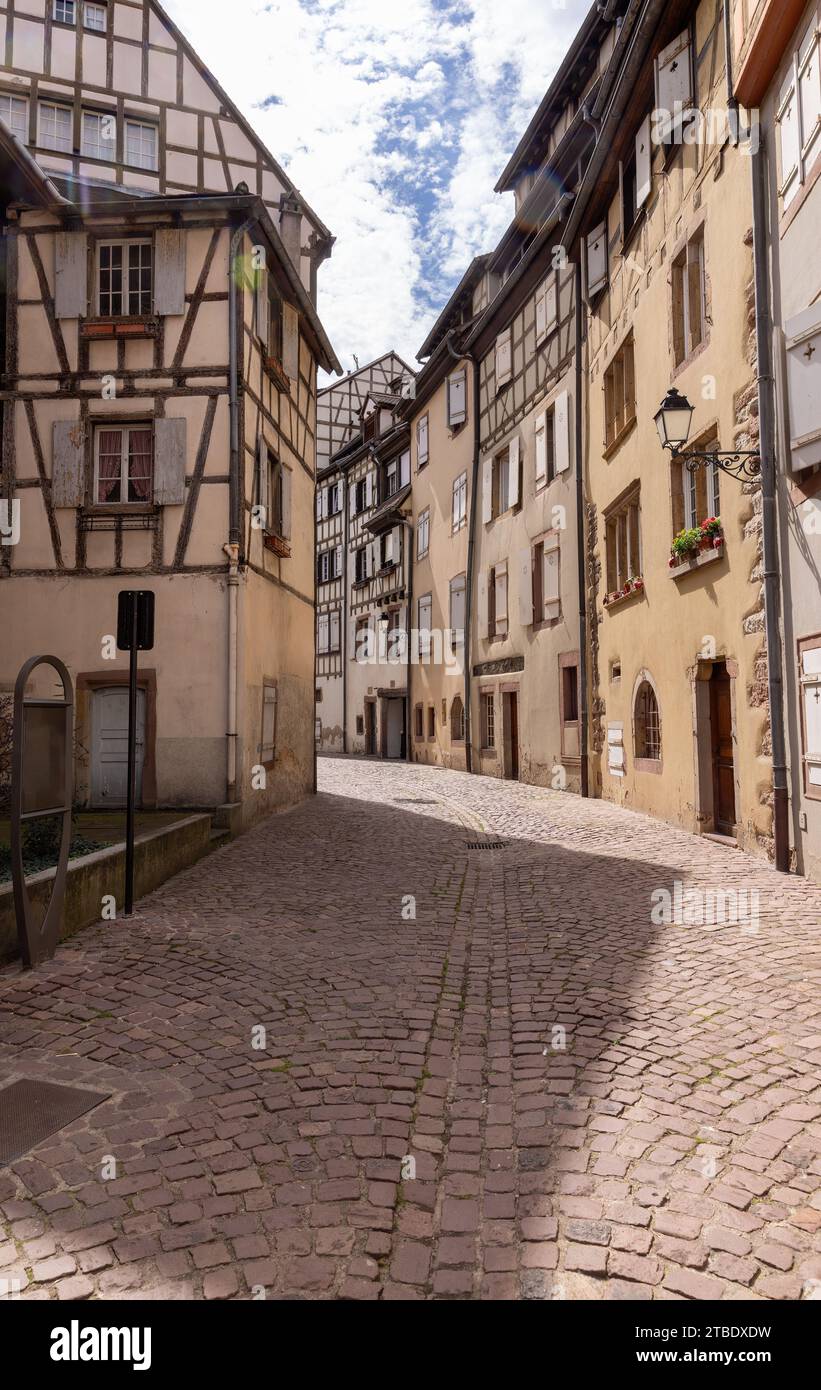 Colmar with a typical, old street with half-timbered houses and ...