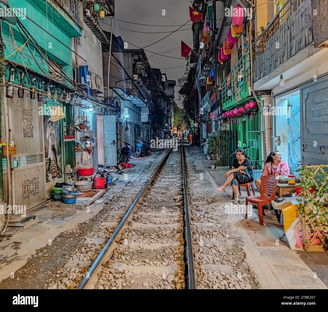 Hanoi, Vietnam - 04 30 2023: Hanoi train street in Vietnam at night. A ...