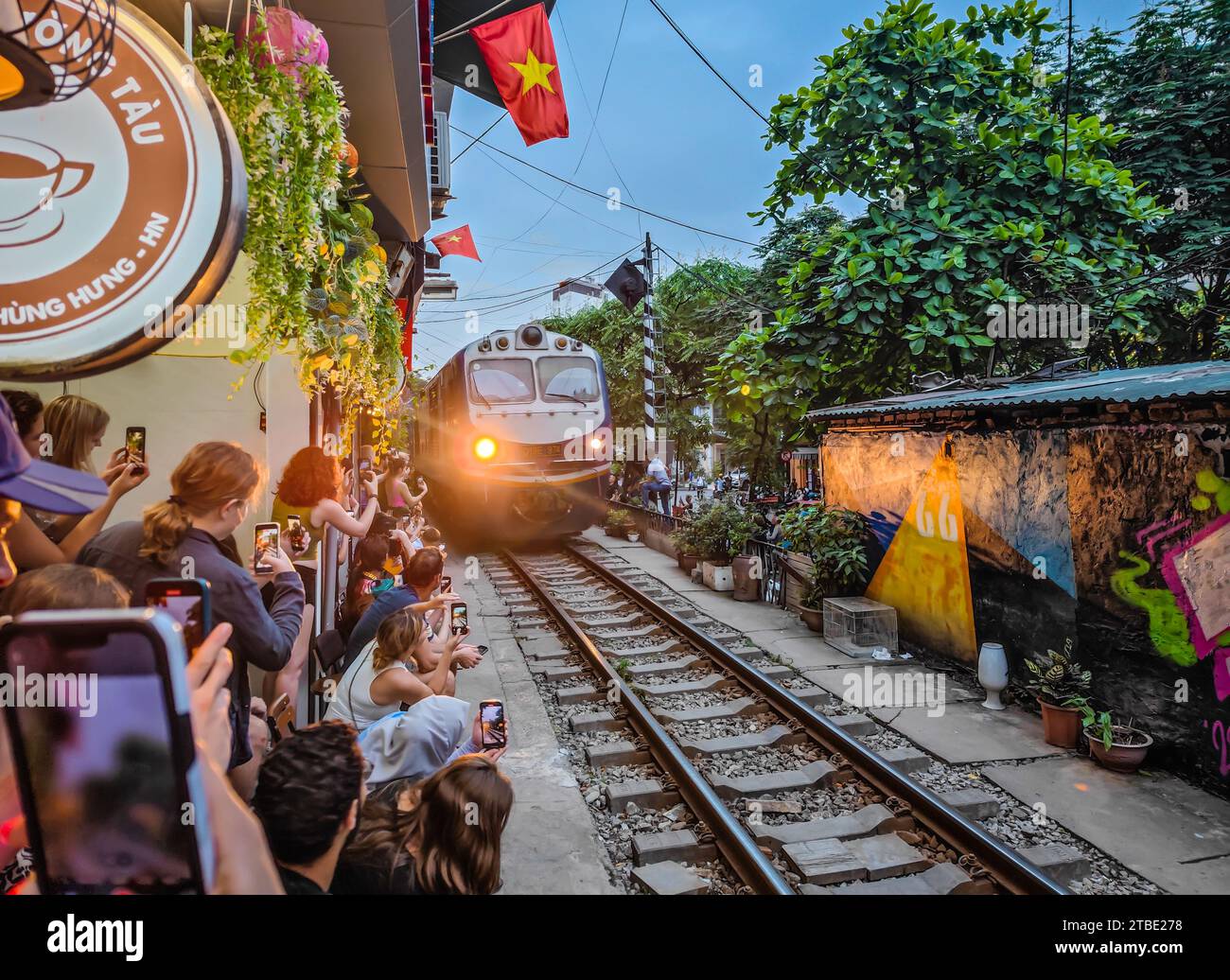 Hanoi, Vietnam - 04 30 2023: Train passing by people in Hanoi train ...