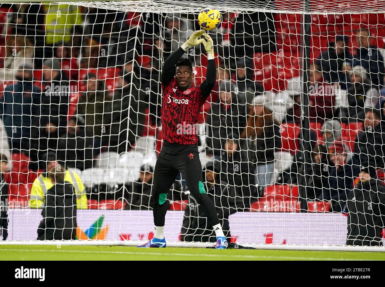 Manchester United goalkeeper Andre Onana warms up prior to the Premier ...