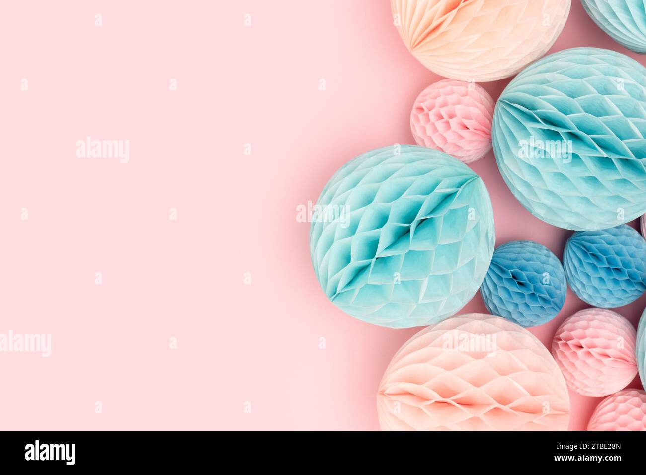 Tissue paper balls different sizes on a pink background. Place for your ...