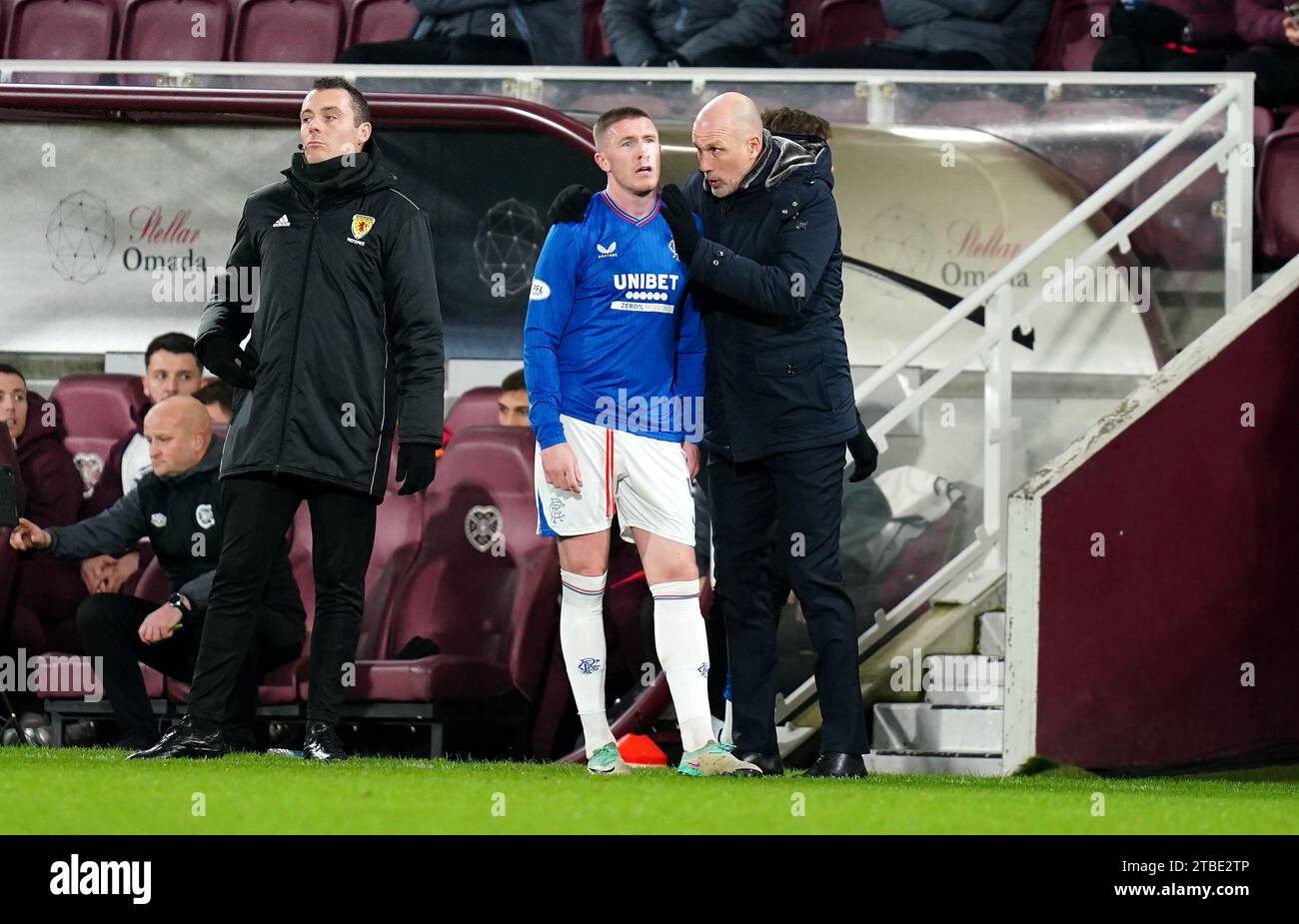 Rangers manager Philippe Clement (right) speaks with John Lundstram ...