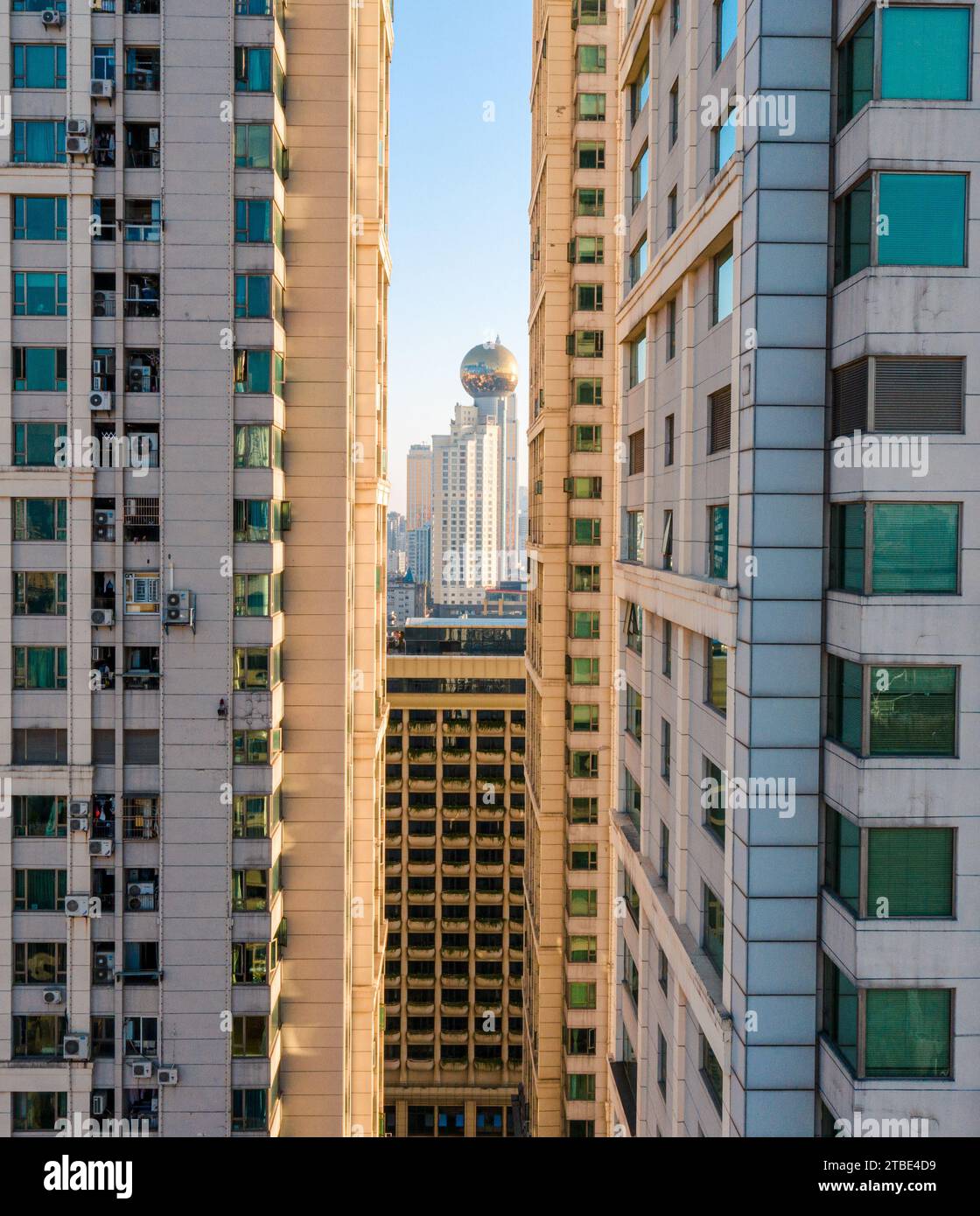 Between the two residential buildings, a skyscraper in the distance ...