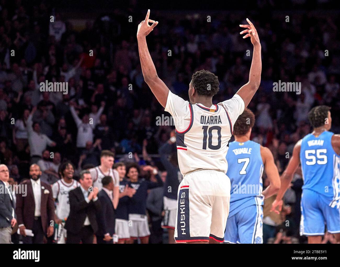 Connecticut Huskies guard Hassan Diarra (10) gets the crowd pumped up ...