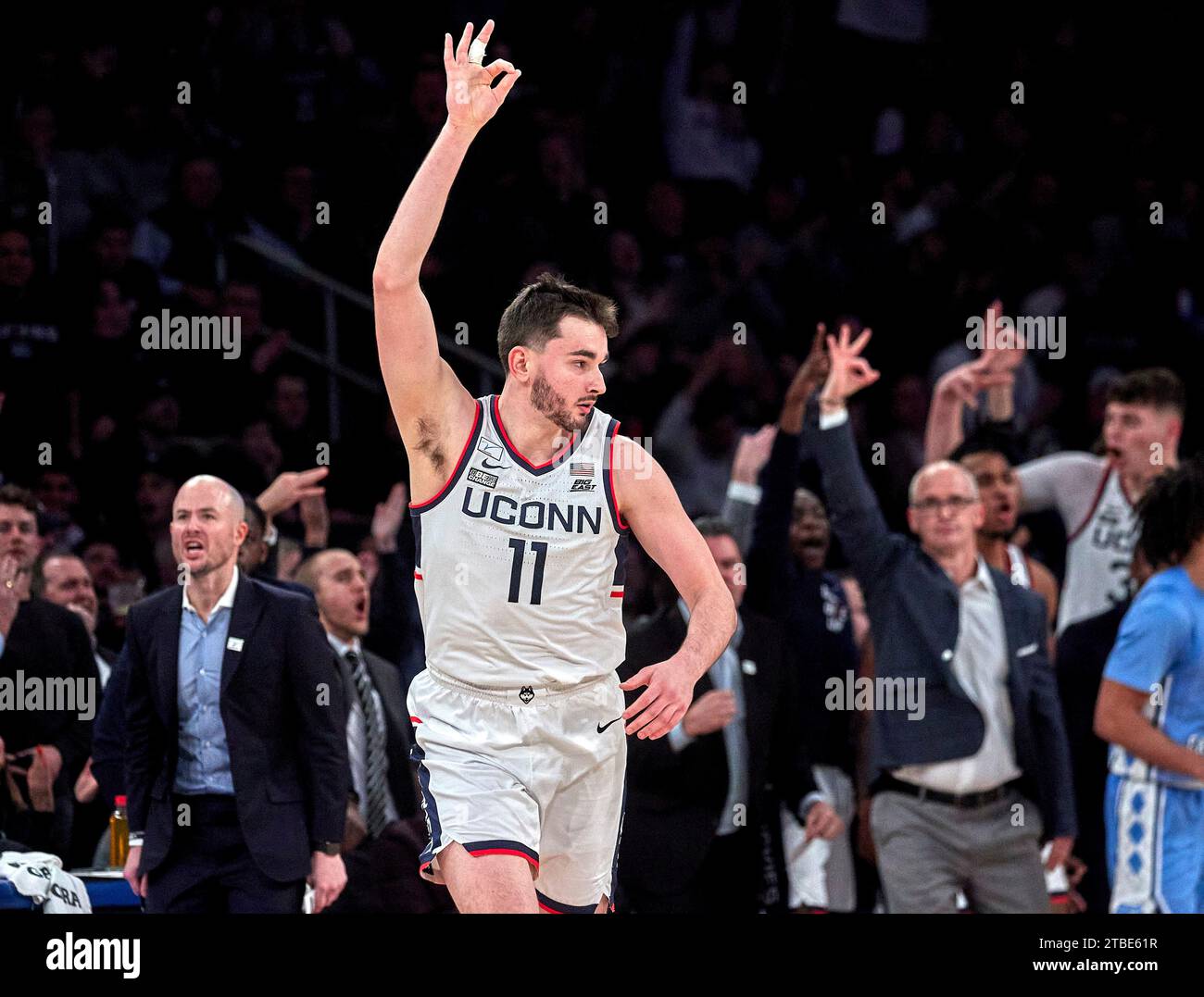 Connecticut Huskies forward Alex Karaban (11) reacts after a three ...