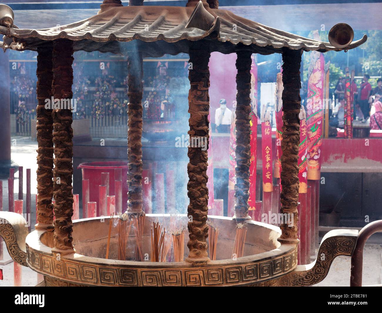 Burning incense sticks in Chinese temple in Hong Kong Stock Photo - Alamy