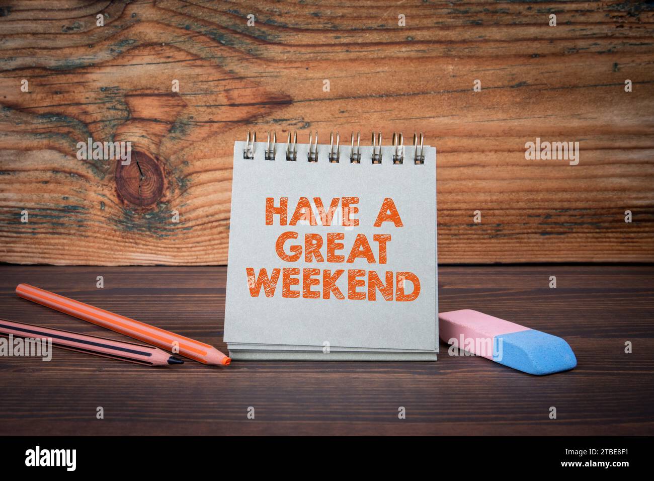 Have a great weekend. Cardboard notepad on wooden texture table Stock ...