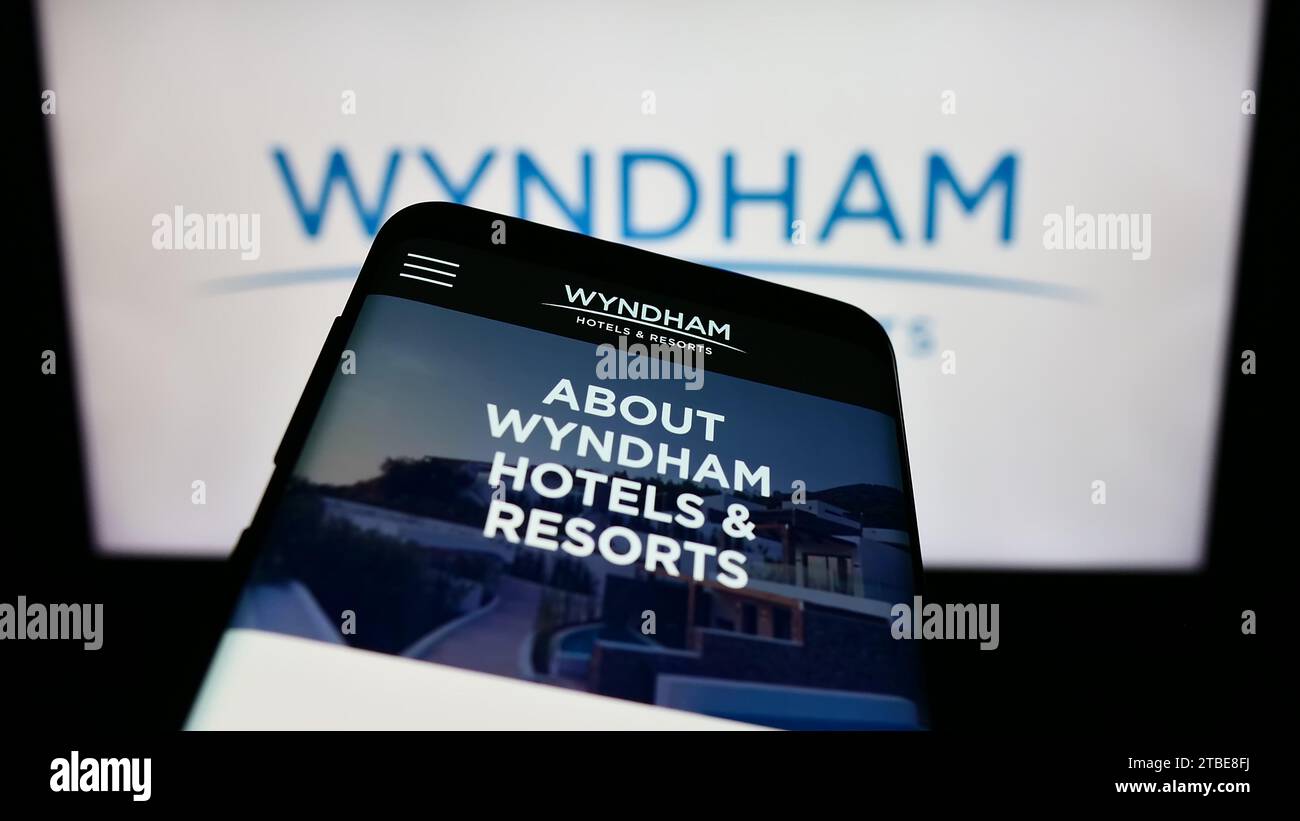 Mobile phone with website of US hotel company Wyndham Hotels and ...