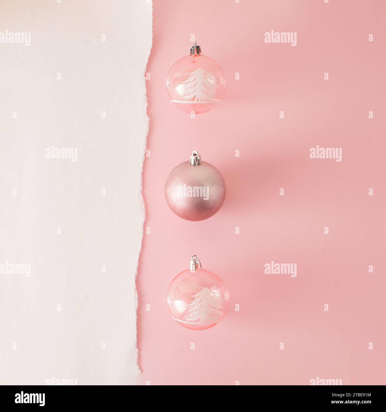 Christmas creative layout with pink bauble decoration on pastel pink ...