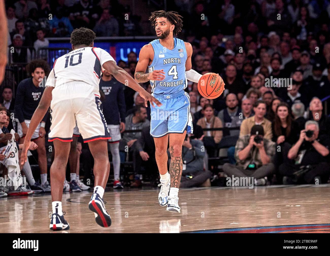 North Carolina Tar Heels guard RJ Davis (4) is defended by Connecticut ...