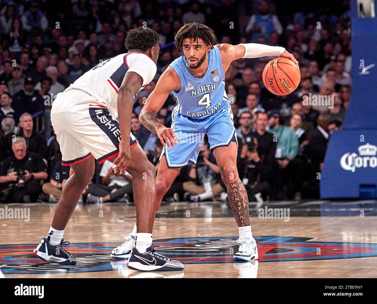 North Carolina Tar Heels guard RJ Davis (4) is defended by Connecticut ...