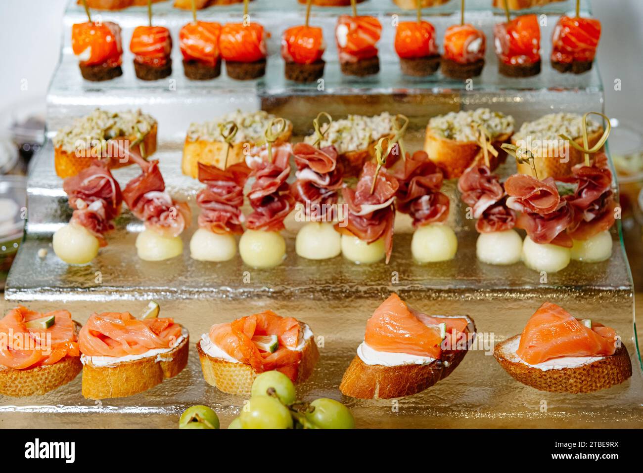 A delectable assortment of canapés, including smoked salmon, prosciutto ...