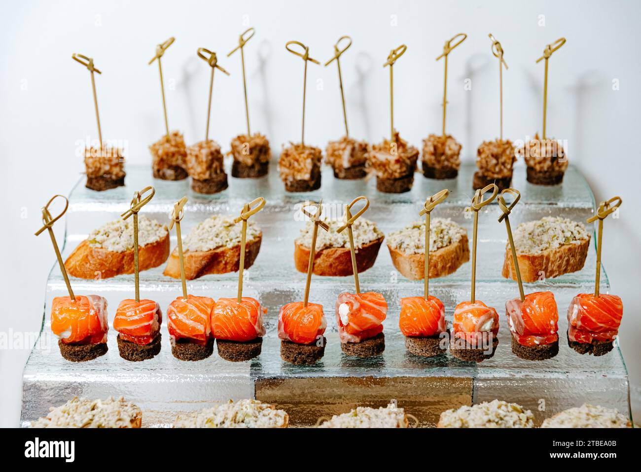 An array of sophisticated smoked salmon canapés with cream cheese on ...