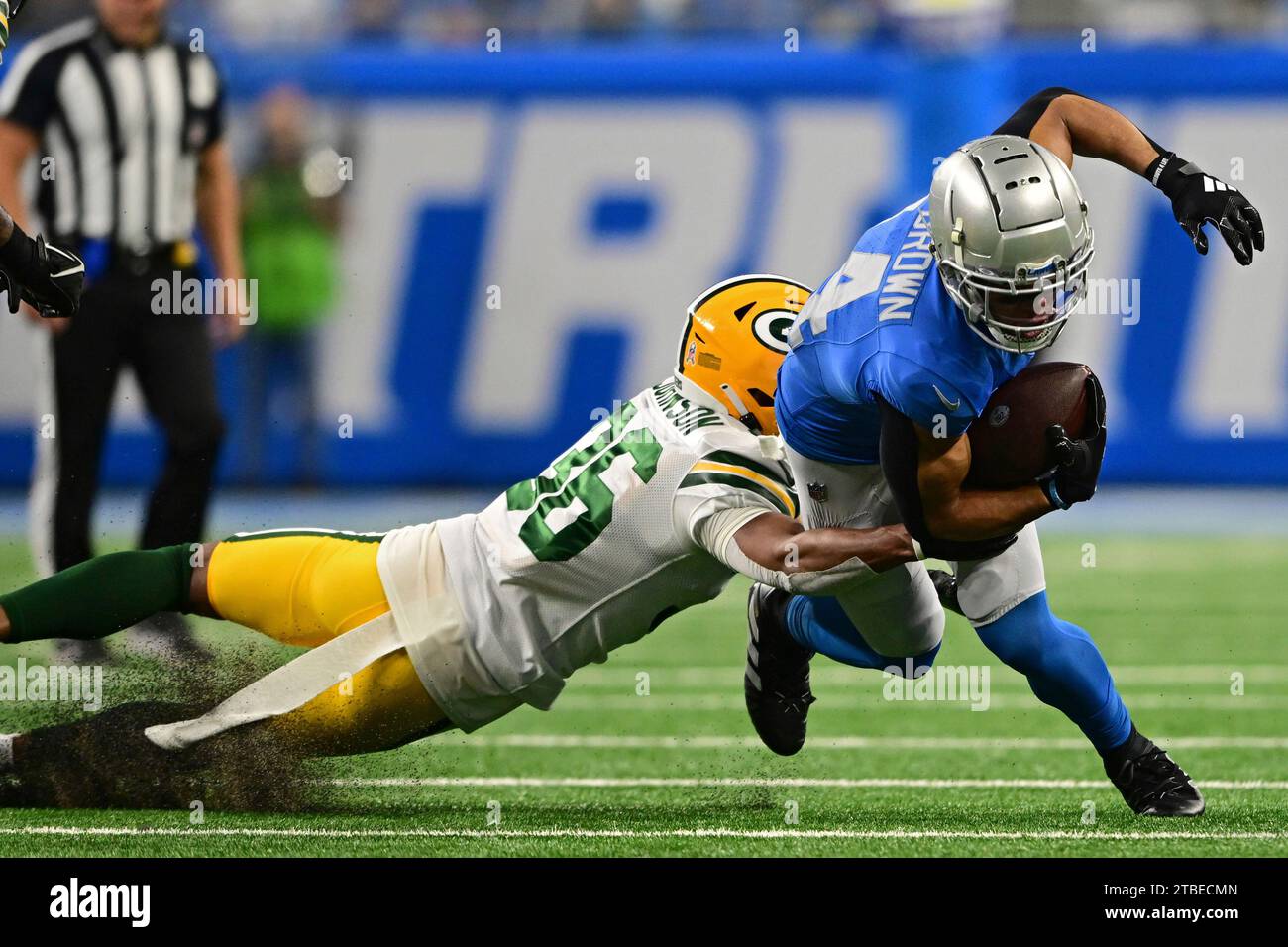 Detroit Lions wide receiver Amon-Ra St. Brown is tackled by Green Bay ...