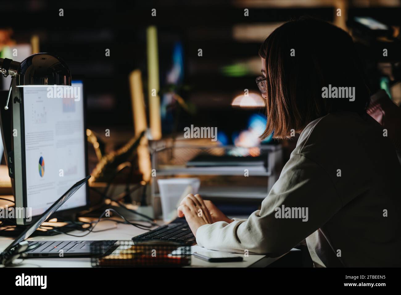 Late-night collaboration in a corporate office as a cross-generational ...