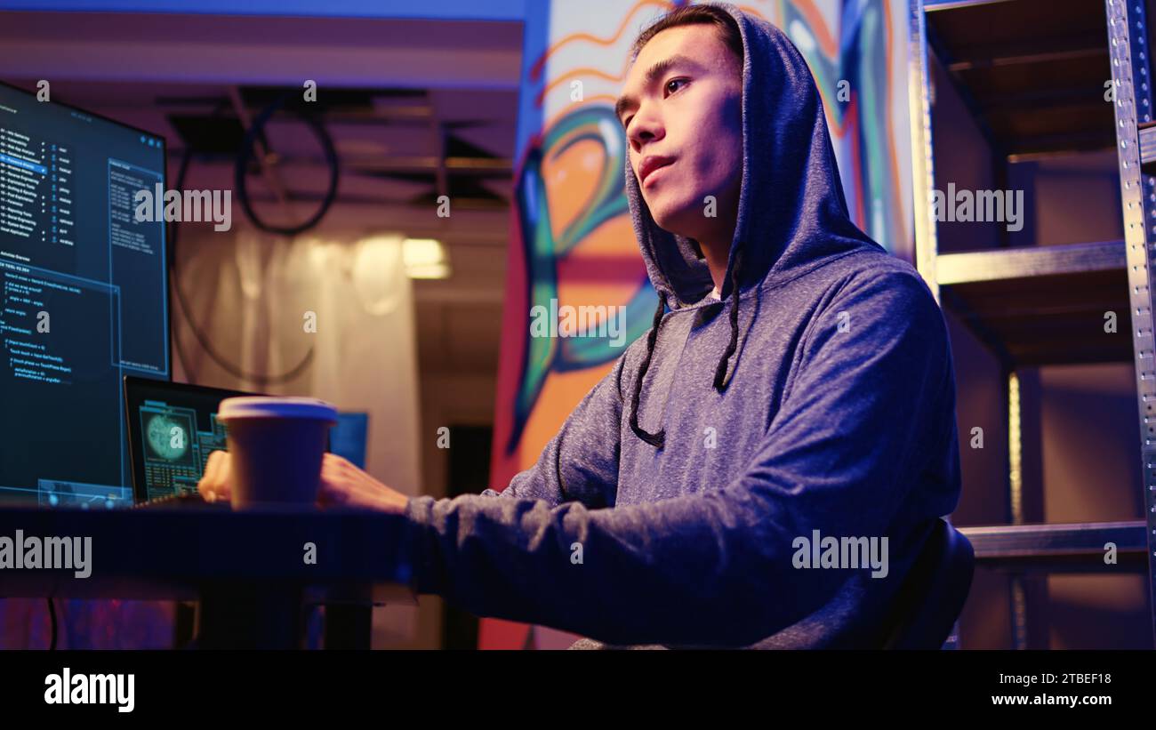 Asian hacker in underground base getting past anti tamper measures ...