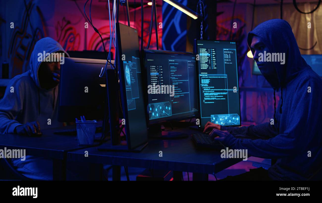 Hackers in dark abandoned warehouse using phishing technique that tricks users into revealing ...