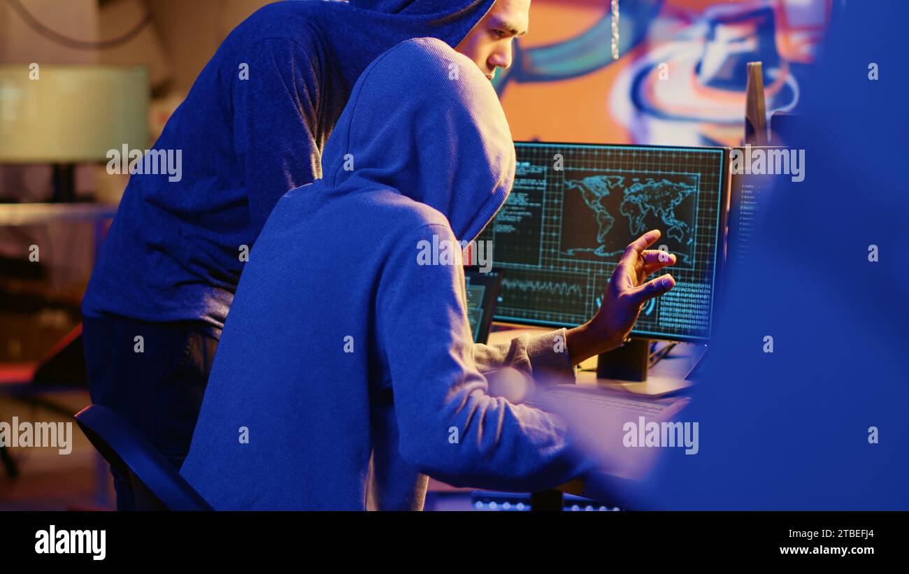 Hacking group founder initiating new member, showing him how to destroy ...