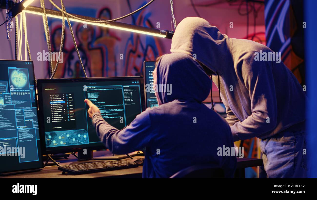 Evil cybercriminals in graffiti sprayed hideaway targeting vulnerable ...