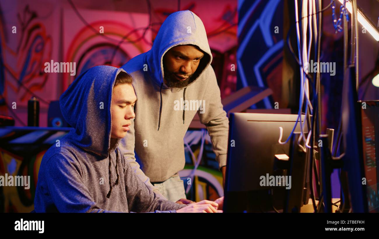 Hacking group leader teaching new member how to steal valuable data by ...